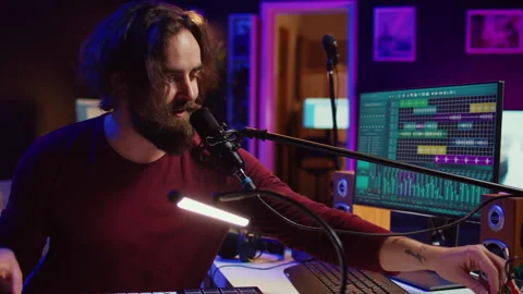 Artist singing a song at microphone and ... | Stock Video | Pond5