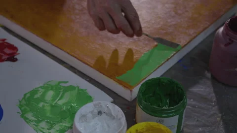 Artist Uses a Palette Knife to Spread Pa... | Stock Video | Pond5