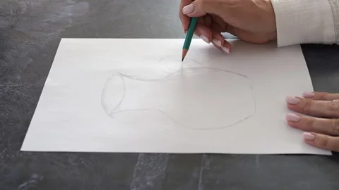 Artist woman creates art sketch on paper... | Stock Video | Pond5