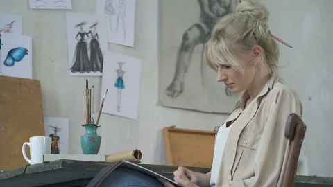 Artist woman at the workplace drawing pe... | Stock Video | Pond5