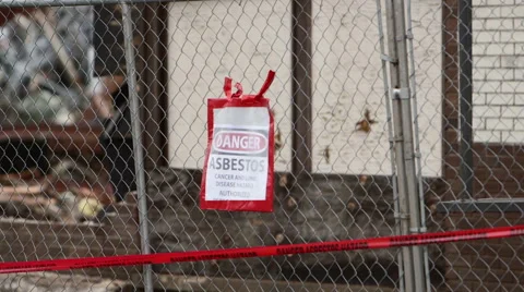 Asbestos warning sign on demolition zone... | Stock Video | Pond5