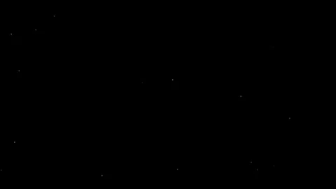 Ashes of a fire flying in the air on a b... | Stock Video | Pond5