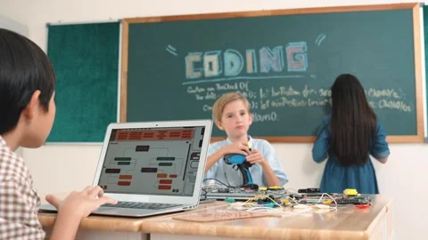 Asian boy coding program while friend fi... | Stock Video | Pond5