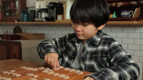 Asian boy playing Shogi game, Japanese c... | Stock Video | Pond5
