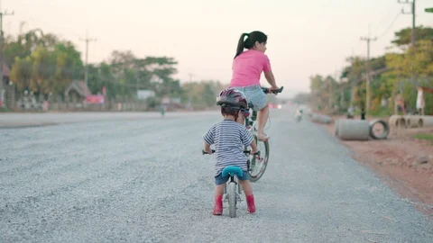 Asian boy is riding baby balance bike af... | Stock Video | Pond5