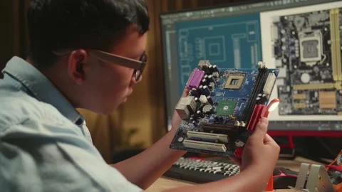 Asian Boy Is Working With Desktop Comput... | Stock Video | Pond5