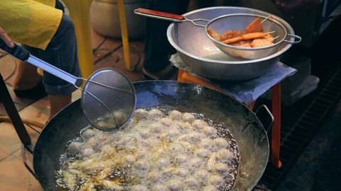 Asian Chef Frying Fish Balls on Palm Oil... | Stock Video | Pond5