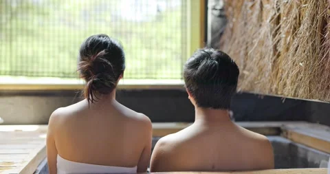 Asian couple enjoy onsen bathtub togethe... | Stock Video | Pond5