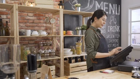 asian customer ordering at counter in co... | Stock Video | Pond5