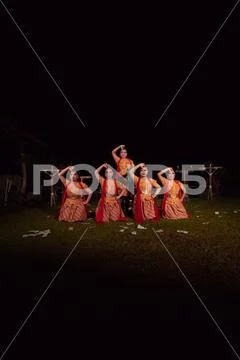 Asian dancers take pose with dance movements while performing the ...
