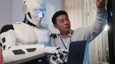 Asian engineer with AI robot learning 3d... | Stock Video | Pond5