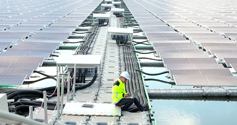 Asian engineer working at Floating solar... | Stock Video | Pond5