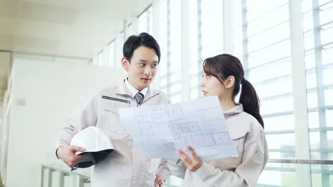 Asian engineers standing in the building... | Stock Video | Pond5