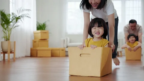 asian family playing with a box.Together... | Stock Video | Pond5