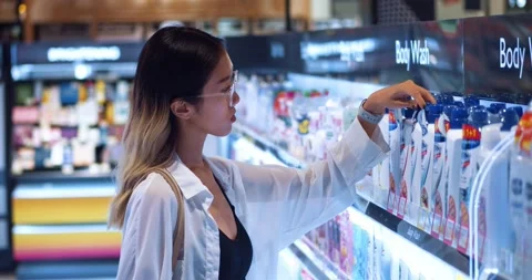 An Asian female 20s consumer chooses a h... | Stock Video | Pond5