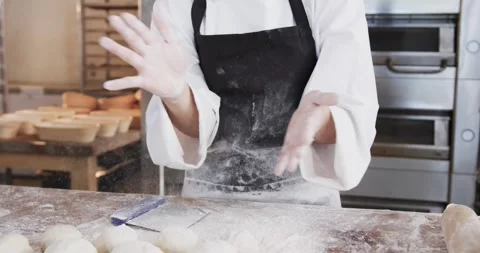 Asian female baker working in bakery kit... | Stock Video | Pond5