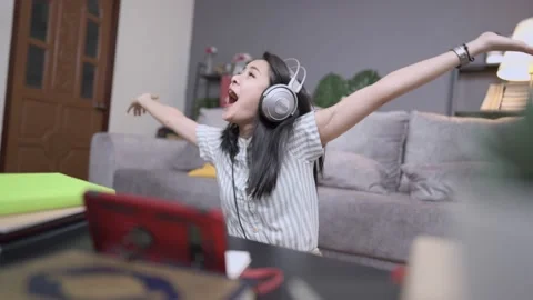 asian girl finally finish homework on ti... | Stock Video | Pond5