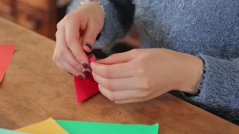 Asian girl folding Origami, Japanese tra... | Stock Video | Pond5