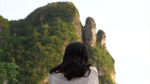 Asian girl standing and staring at sun s... | Stock Video | Pond5
