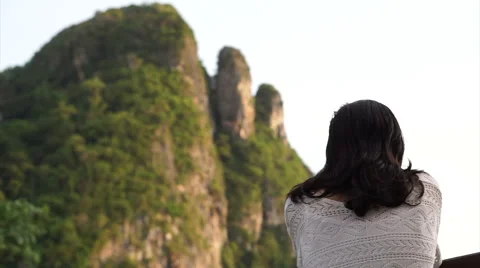 Asian girl standing and staring at sun s... | Stock Video | Pond5