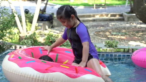 asian girl in swimsuit and float on infl... | Stock Video | Pond5