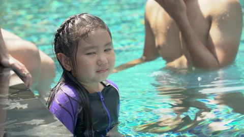 asian girl in swimsuit crying in Swimmin... | Stock Video | Pond5