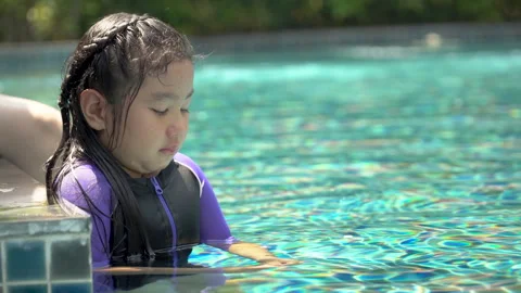 asian girl in swimsuit crying in Swimmin... | Stock Video | Pond5