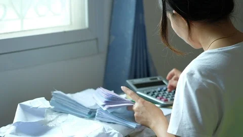 Asian girls are using calculators to mak... | Stock Video | Pond5