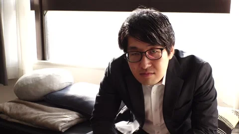 Asian (Japanese) young man wearing a sui... | Stock Video | Pond5