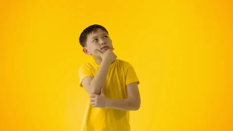 Asian kid boy wondering and thinking str... | Stock Video | Pond5