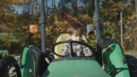 Asian kid playing behind the wheel of an... | Stock Video | Pond5
