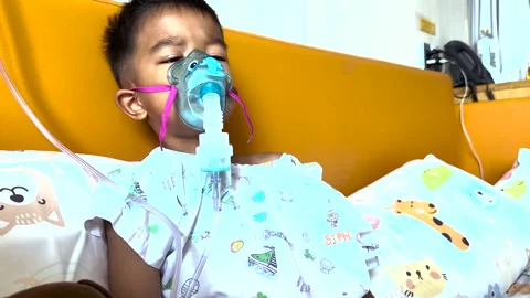 Asian little kind boy is patient by inha... | Stock Video | Pond5