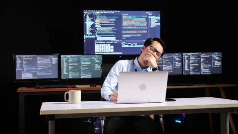 Asian Male Programmer Yawning While Writ... | Stock Video | Pond5