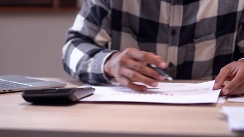 Asian man calculating checking balance a... | Stock Video | Pond5