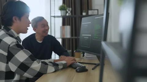 Asian man coding and programming on scre... | Stock Video | Pond5