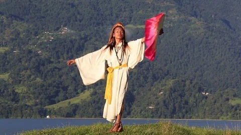 Asian man dancing with a fan at sunrise ... | Stock Video | Pond5