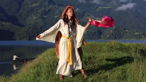 Asian man dancing with a fan at sunrise ... | Stock Video | Pond5