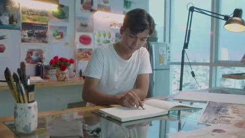 Asian Man Drawing Sketch at Workplace in... | Stock Video | Pond5