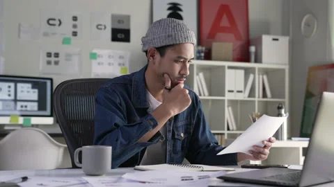 Asian man Graphic designer working in of... | Stock Video | Pond5