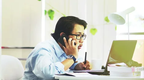 Asian Man Hectic and Busy at Work - Time... | Stock Video | Pond5