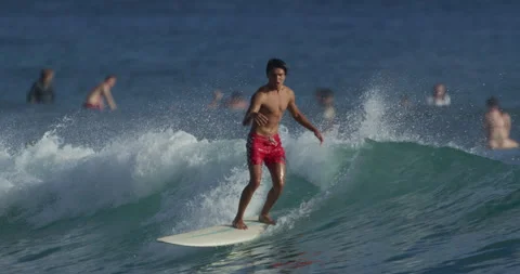 Asian man Surfer surfing longboard ocean... | Stock Video | Pond5