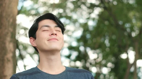 Asian man taking deep breathing in fresh... | Stock Video | Pond5