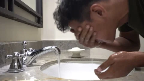 Asian man washing face and rinse hair in... | Stock Video | Pond5
