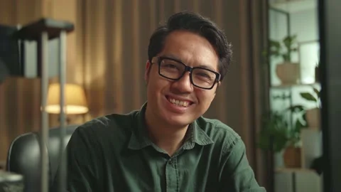 Asian Man Works On Personal Computer And... | Stock Video | Pond5