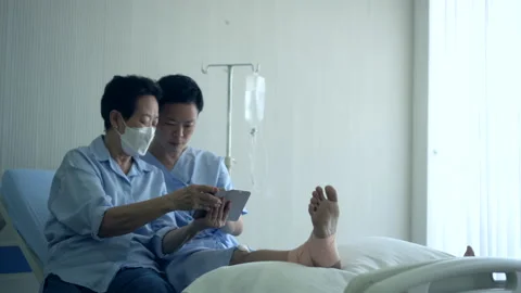 Asian mother and son who indured leg in ... | Stock Video | Pond5