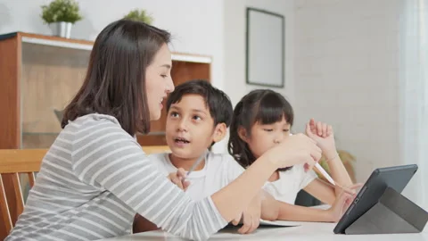 Asian mother teach young son and daughte... | Stock Video | Pond5