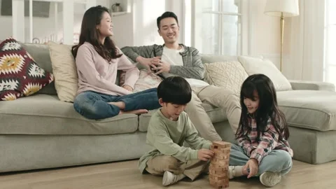 asian parents chatting at home while chi... | Stock Video | Pond5