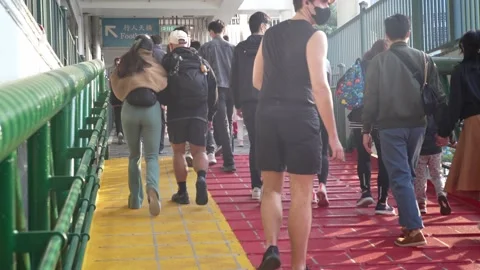 Asian people walking up ramp towards fer... | Stock Video | Pond5