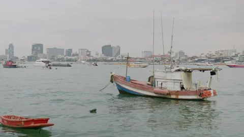 Asian red boat bobbing on the waves with... | Stock Video | Pond5