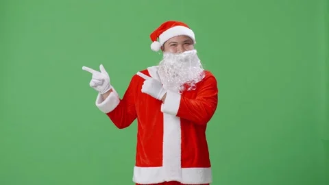 Asian Santa Claus Pointing To The Side W... | Stock Video | Pond5